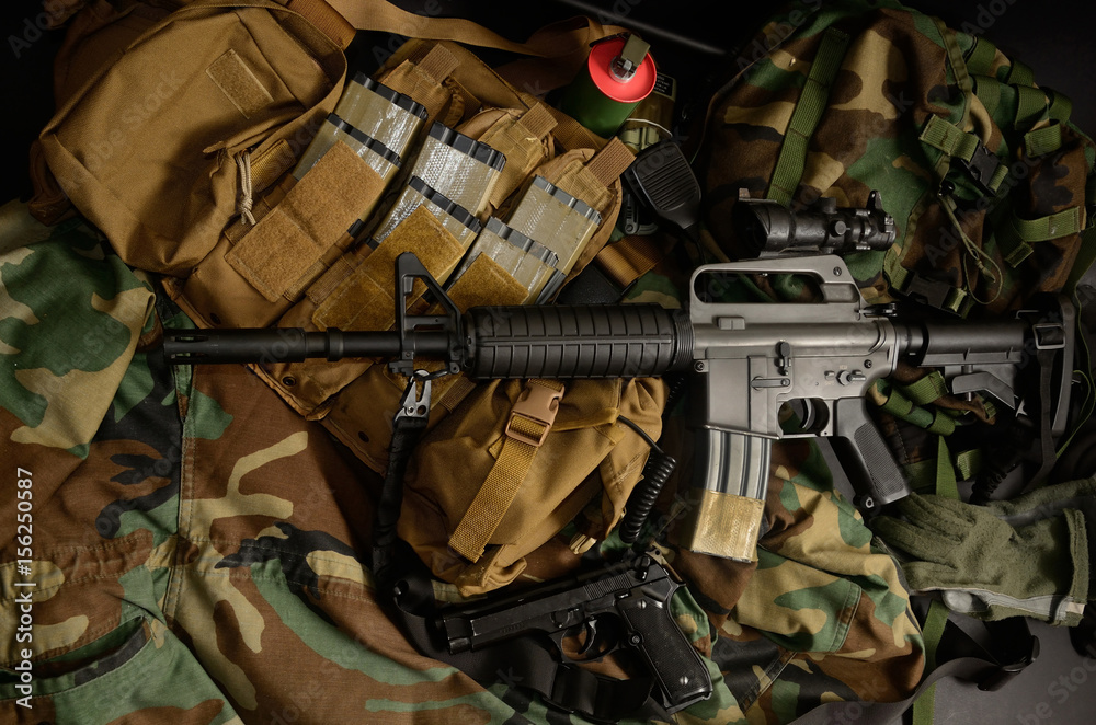 Assault rifle 5.56mm m16 Colt carbine with tactical chest rigs ...