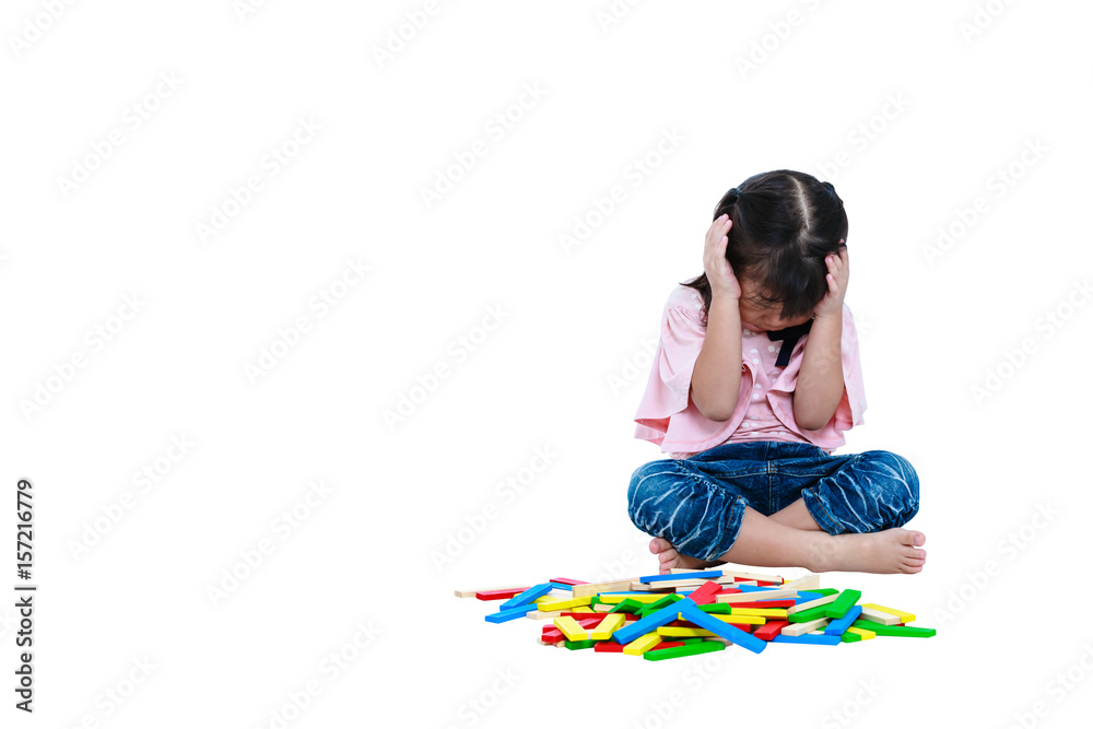 Asian child playing toy wood blocks. Sad girl crying and showing moody ...