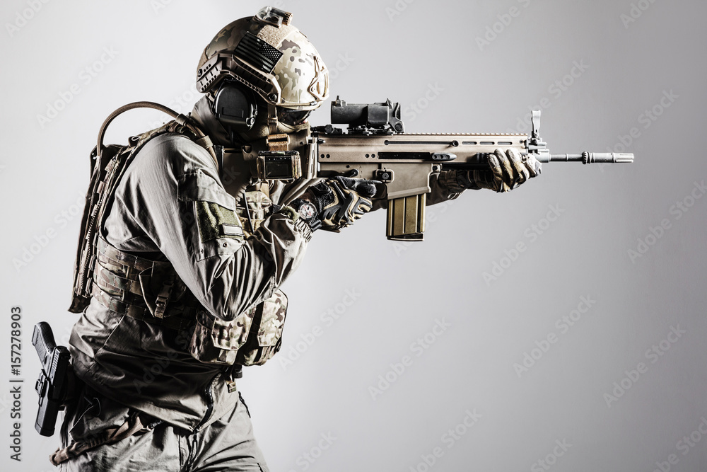 Army soldier in Protective Combat Uniform holding Special Operations ...