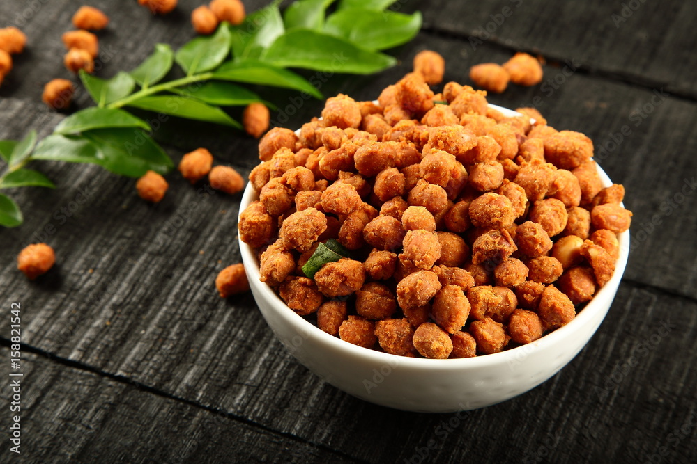 Healthy snack coated peanuts. Stock Photo | Adobe Stock