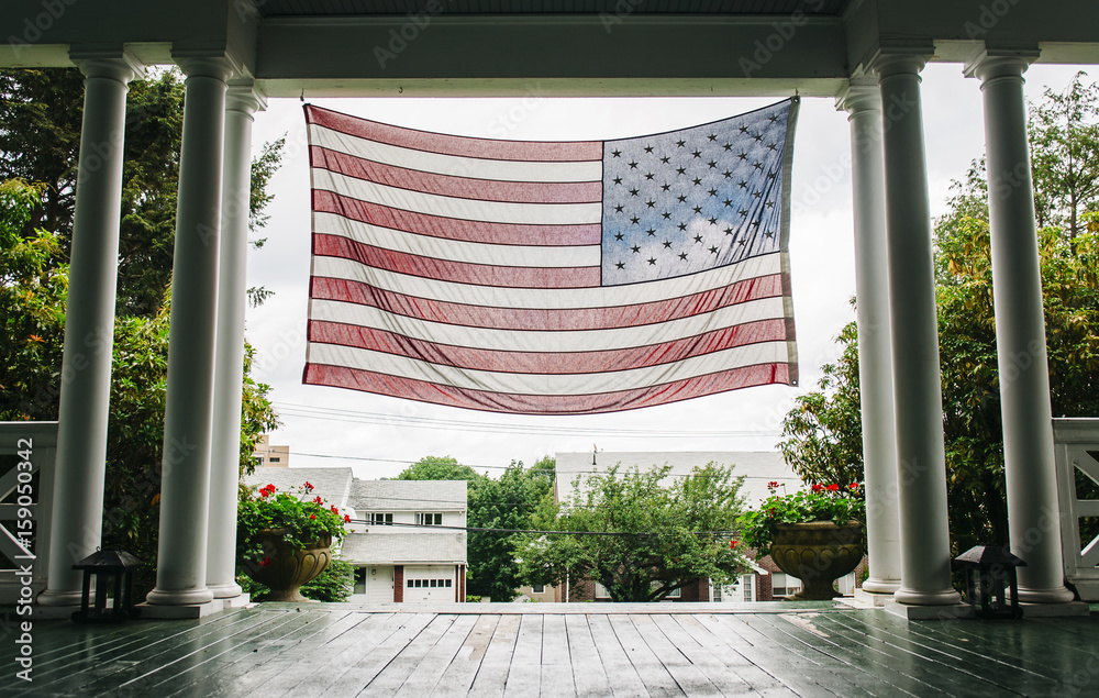 American flag hanging in the entrance of house Stock Photo | Adobe Stock