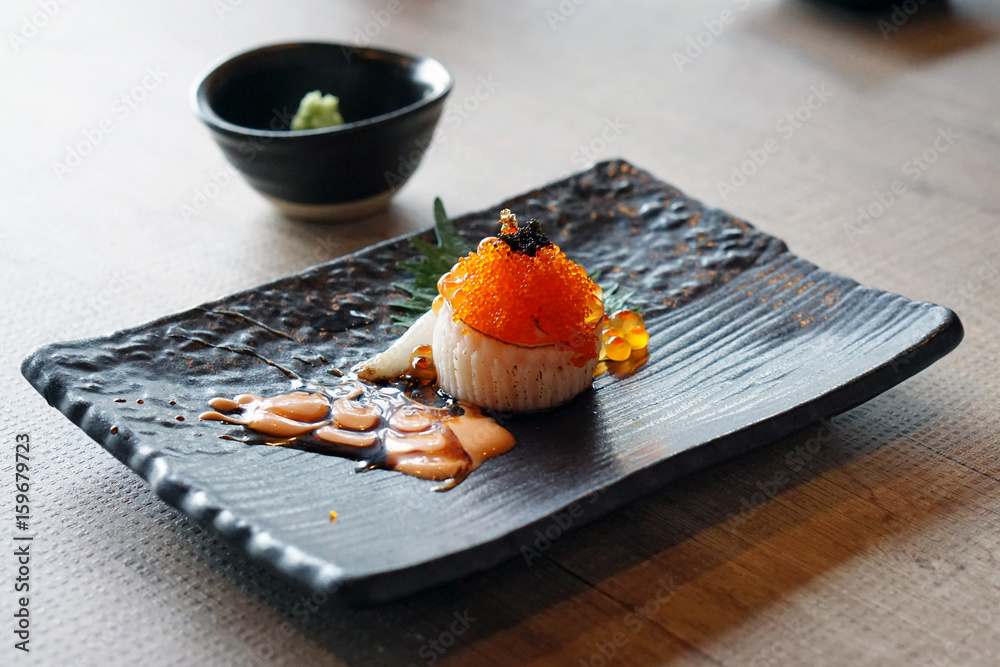 Engawa Sushi Roll topped with Tobiko (Flying fish caviar) and Ikura ...