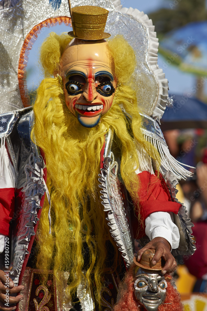 Morenada dancer in traditional Andean costume performing at the annual ...