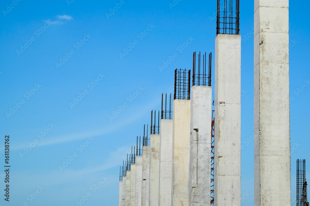 Reinforced concrete column structure in construction site with blue sky ...