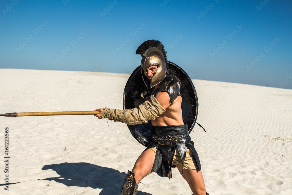 Aggressive Spartan warrior with a spear Stock Photo | Adobe Stock