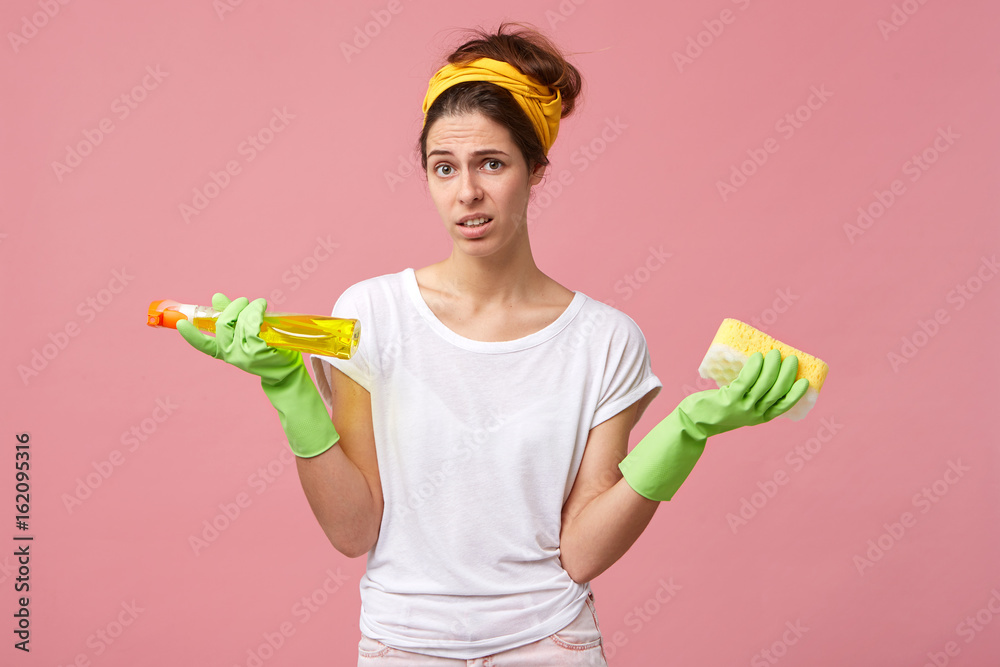 Hygiene, housekeeping and cleanness concept. Unwilling young wife ...