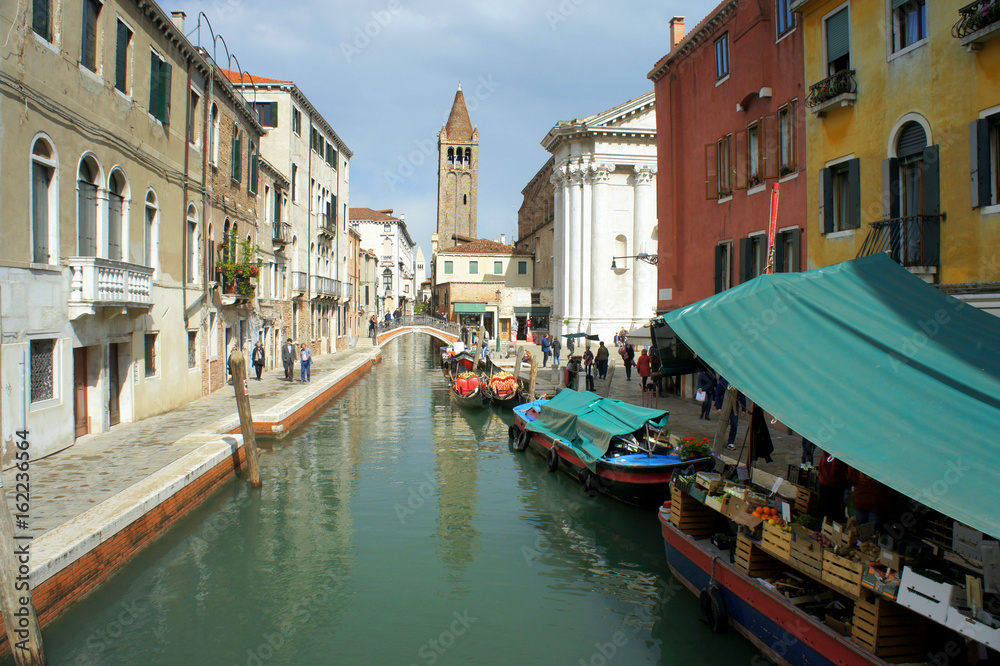Gondolas, church, and floating market. Stock Photo | Adobe Stock