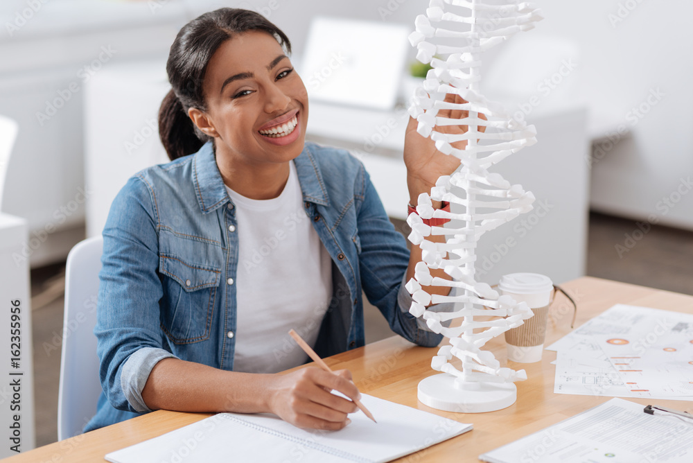Happy nice student studying genetics Stock Photo | Adobe Stock