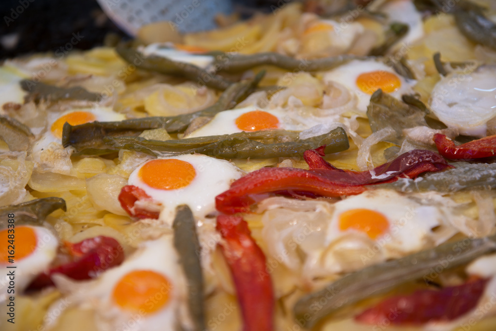 Street food in San Fermin feast, Pamlona, Navarra, Spain. Fried eggs ...