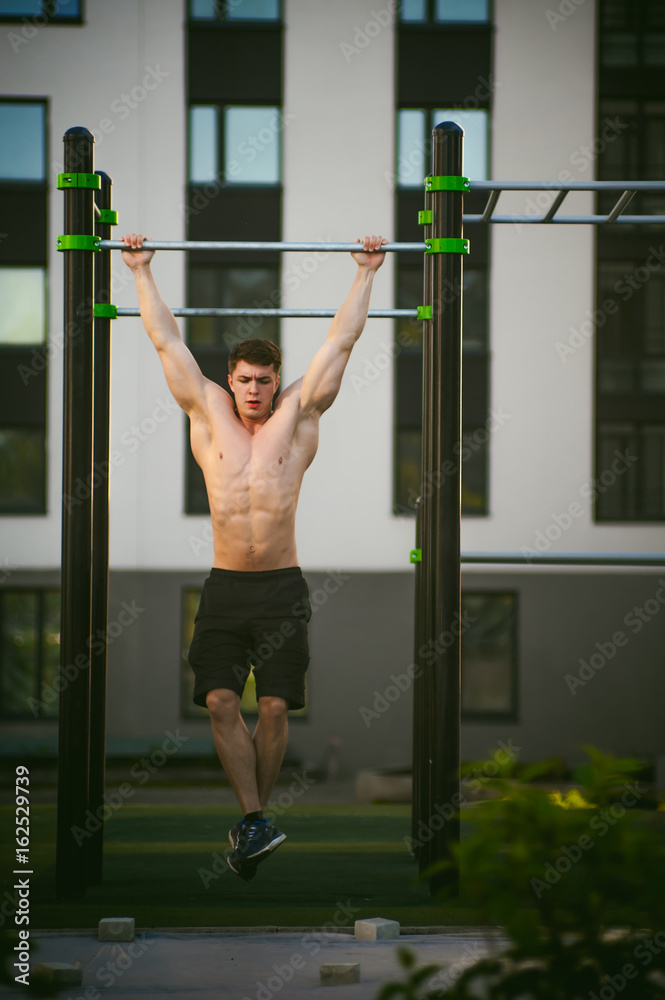 Handsome sexy male bodybuilder athlete man doing crossfit workout in ...