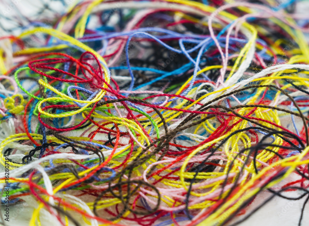 Bright multicolored tangled threads. Extreme close-up. Abstract image ...