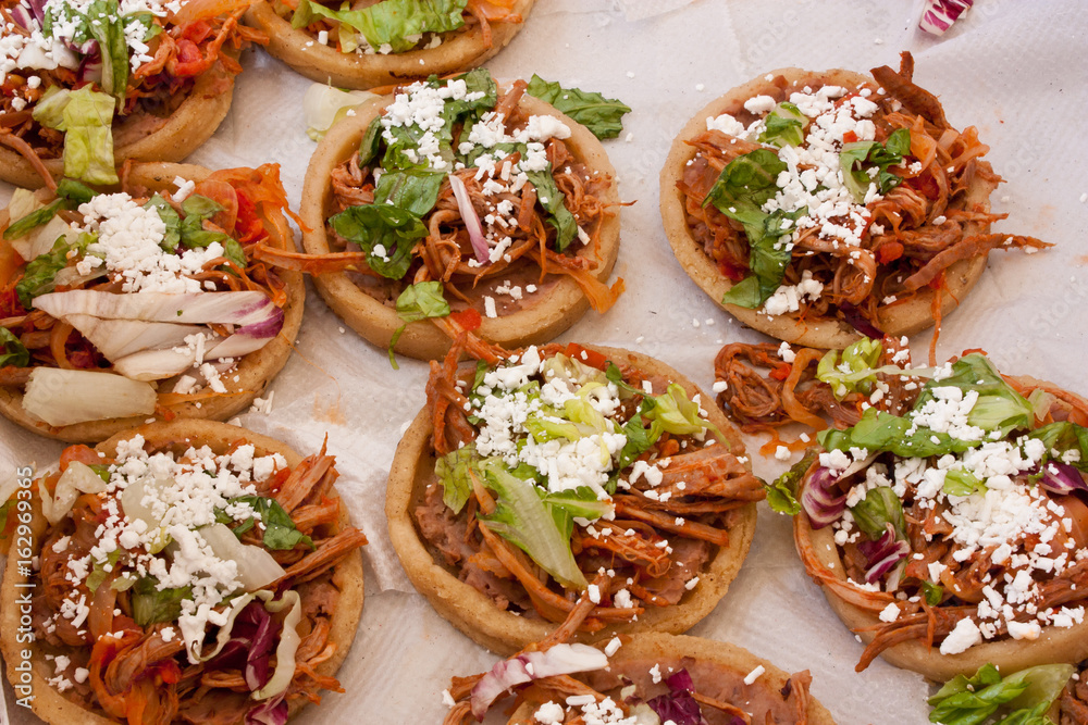 Sopes de tinga de pollo Stock Photo | Adobe Stock