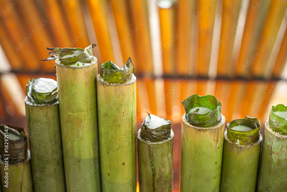 lemang cooking for Hari Raya Aidil Fitri or Eid Mubarak. Lemang is a ...