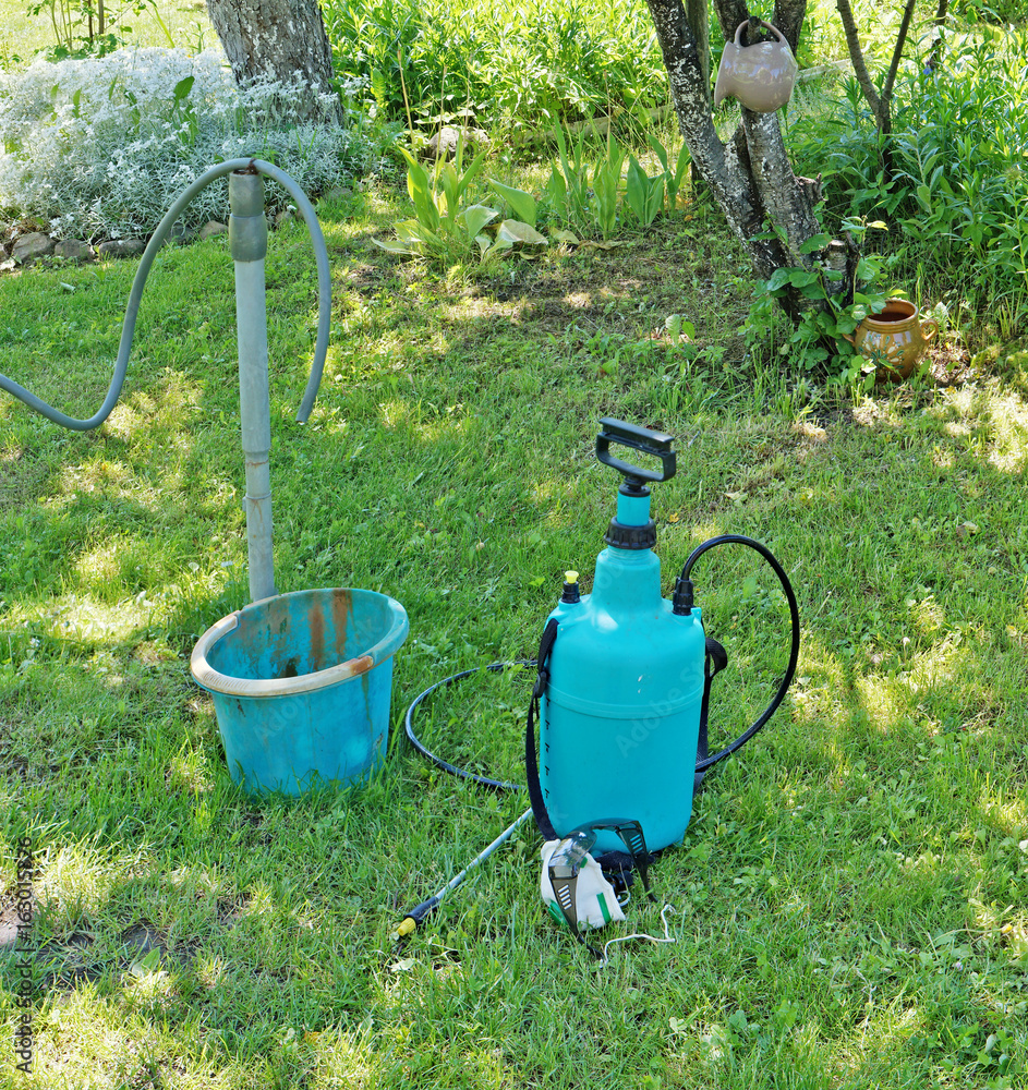 Preparation and filling of a garden sprayer with a herbicide for ...
