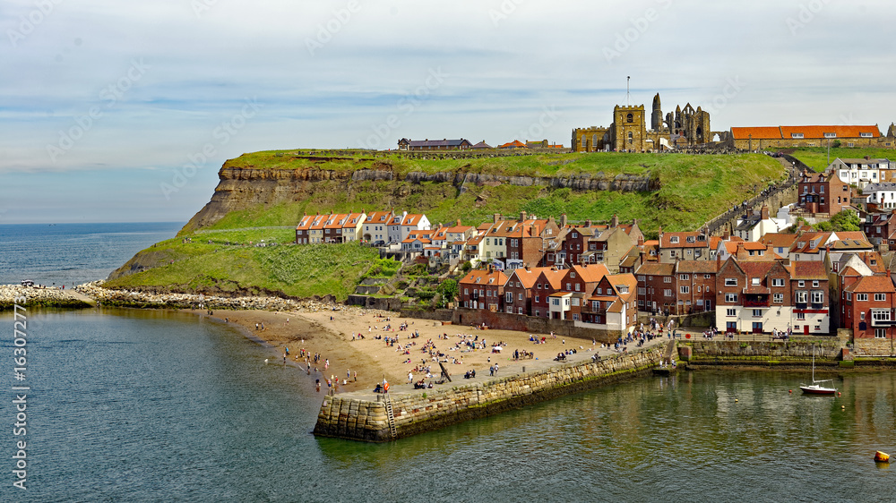 View across the harbor of the east cliff of the popular tourist town of ...