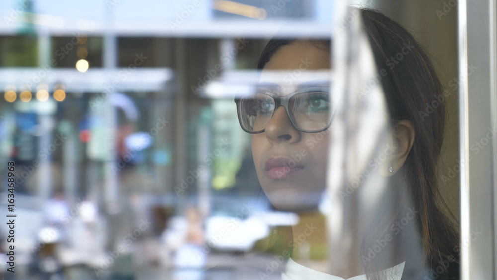 Portrait of a young beautiful business woman (student) in a suit ...