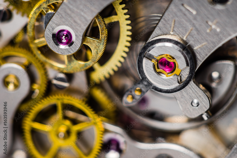 Stock-Foto „Mechanical watch movement, macro of balance ruby jewel ...