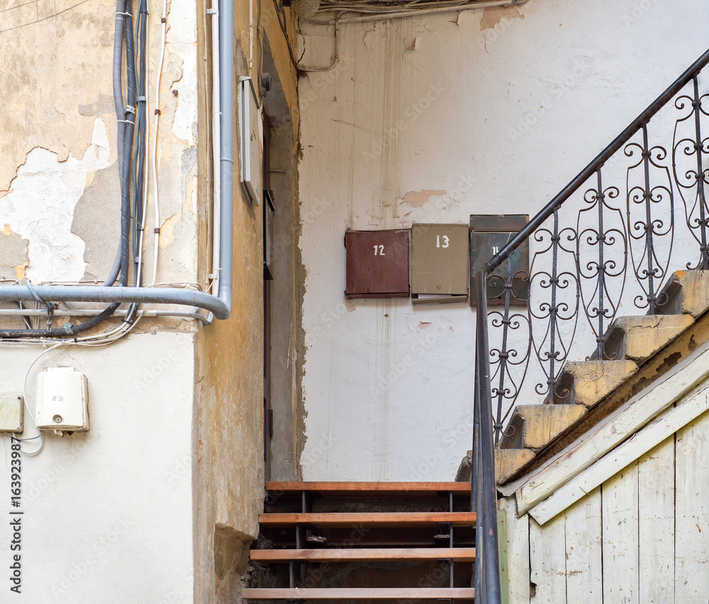 inner yard of a house with staircases, post boxes Stock Photo | Adobe Stock
