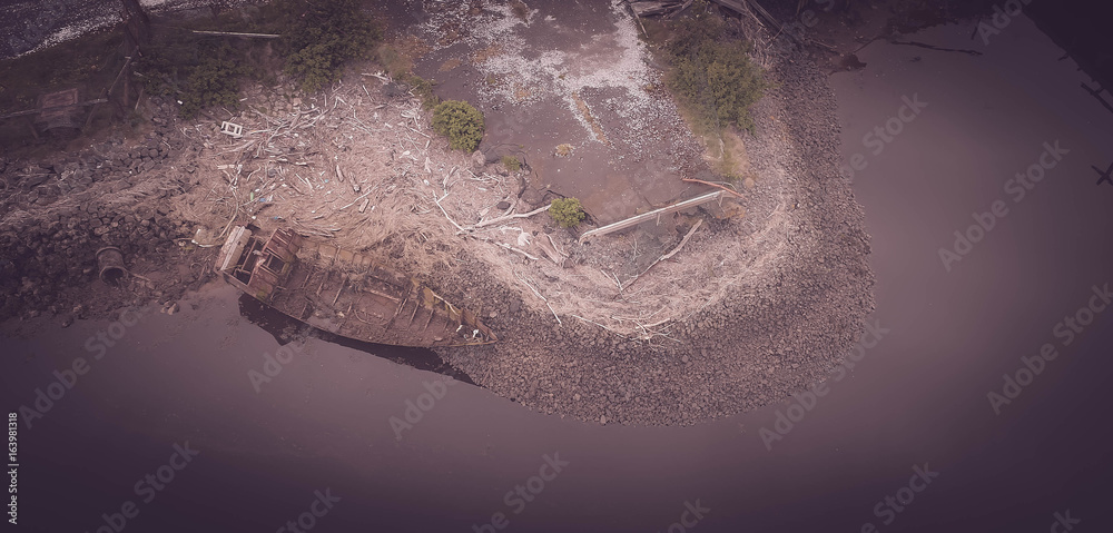 Shipwreck lying on its side against the rocks Stock Photo | Adobe Stock
