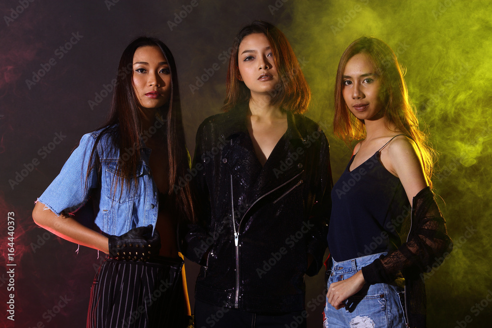 Three Models, low key portrait of slim healthy woman in black ...