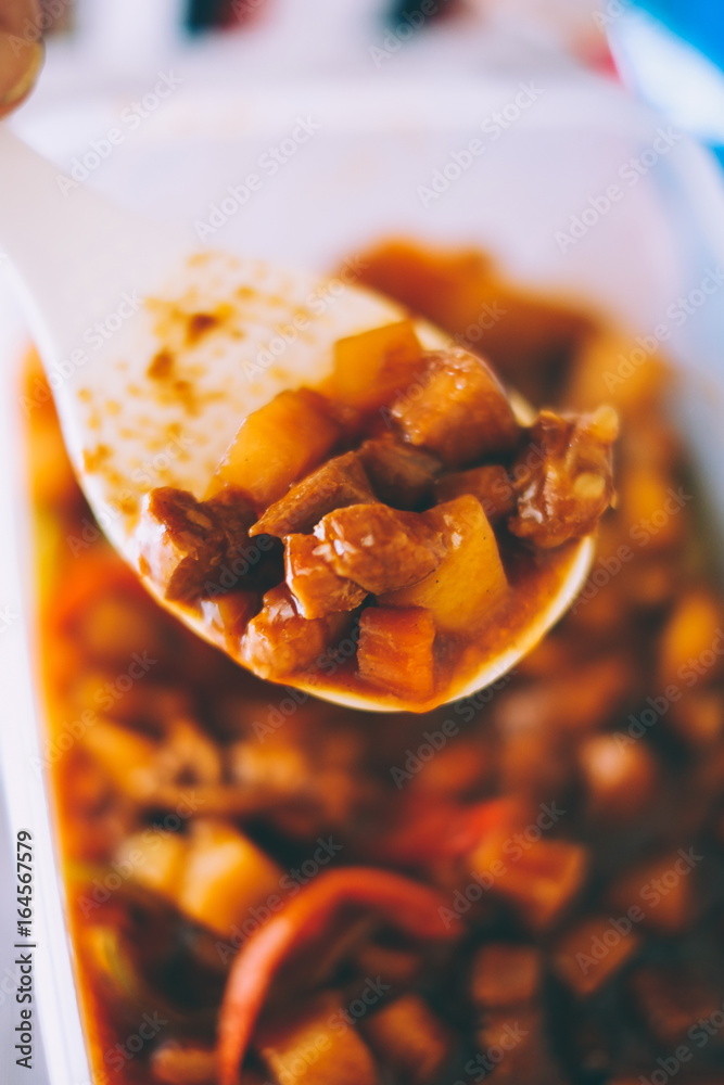 Menudo Filipino food, pork meat and vegetables with tomato sauce ...