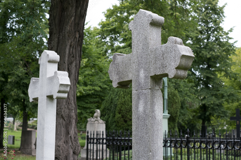 Stone cross gravestones on cemetery - graveyard Stock Photo | Adobe Stock