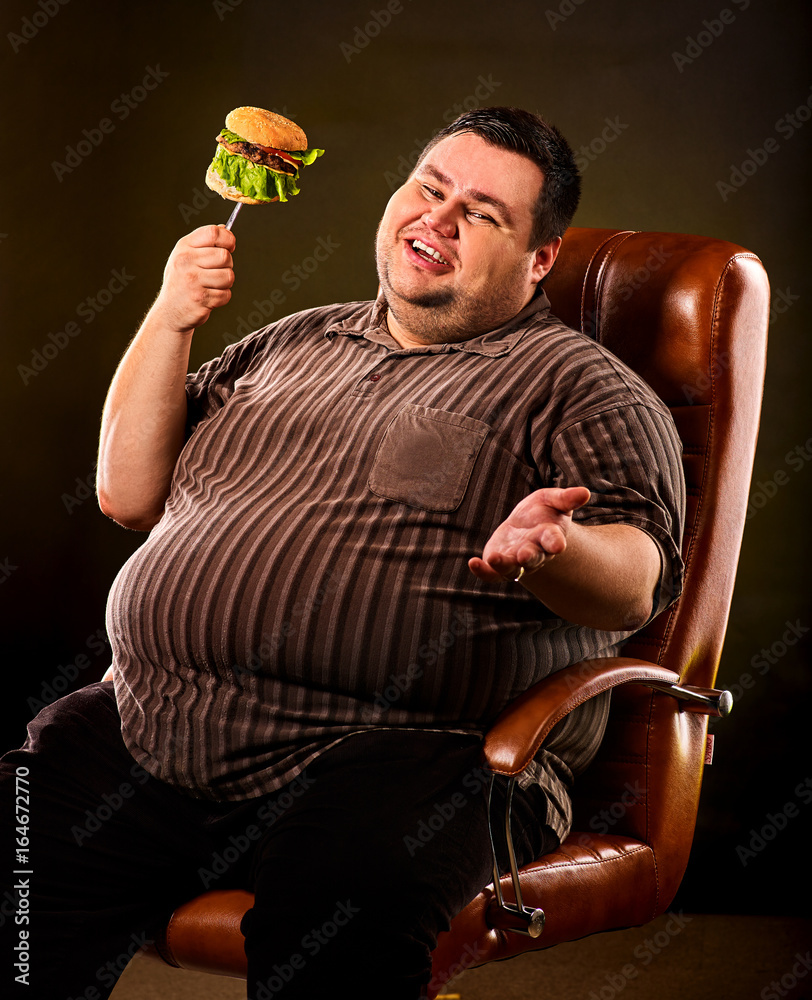 Photo Stock Diet failure of fat man eating fast food hamberger. Happy ...