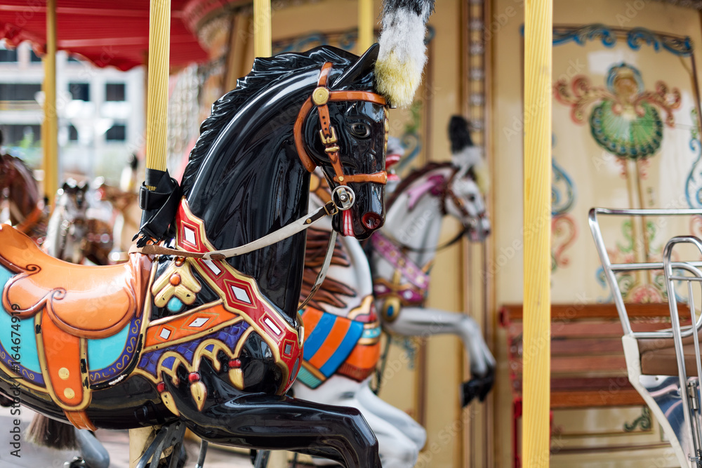 Horses on a carnival Merry Go Round. Old French carousel in a holiday ...