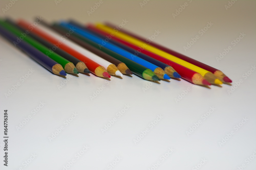 Different colored pencils stacked next to each other portraying ...