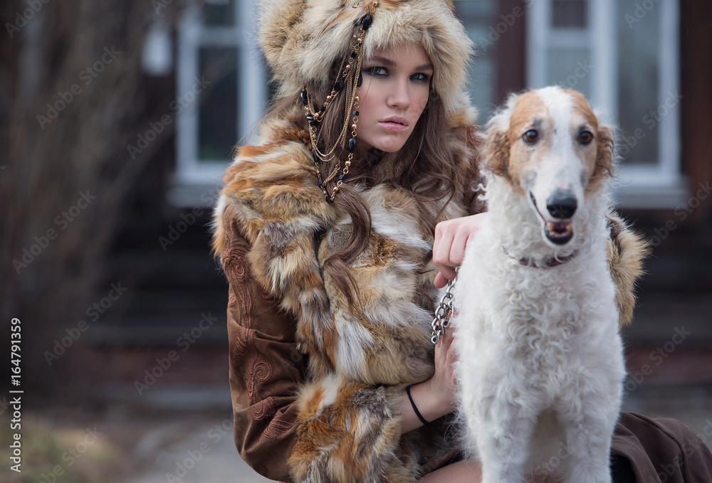 Beautiful girl, model with a pet dog in a beautiful outfit in the ...