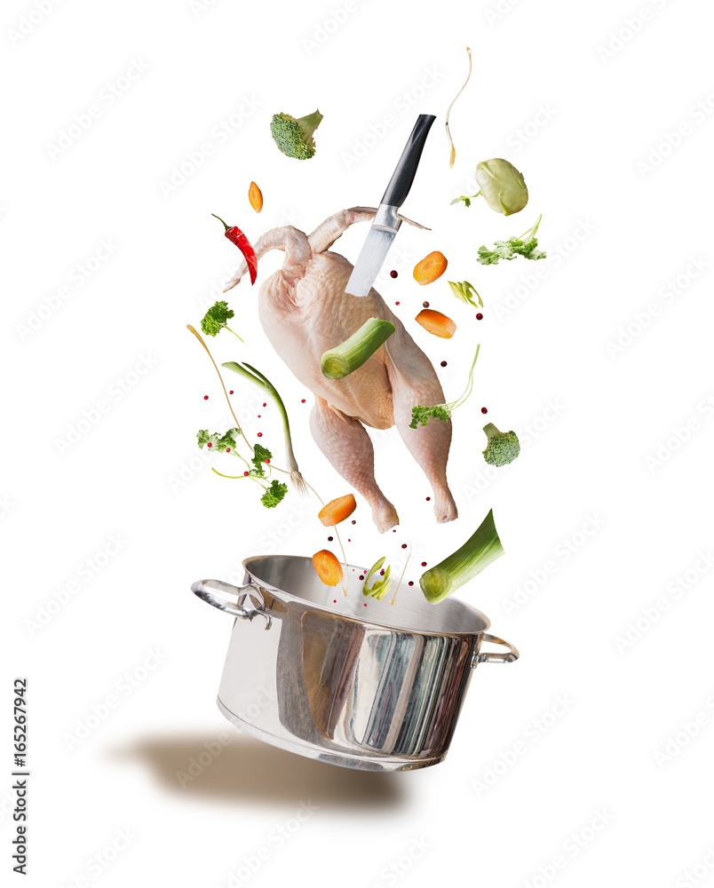 Flying raw chicken stock ,bouillon or soup ingredients with whole ...