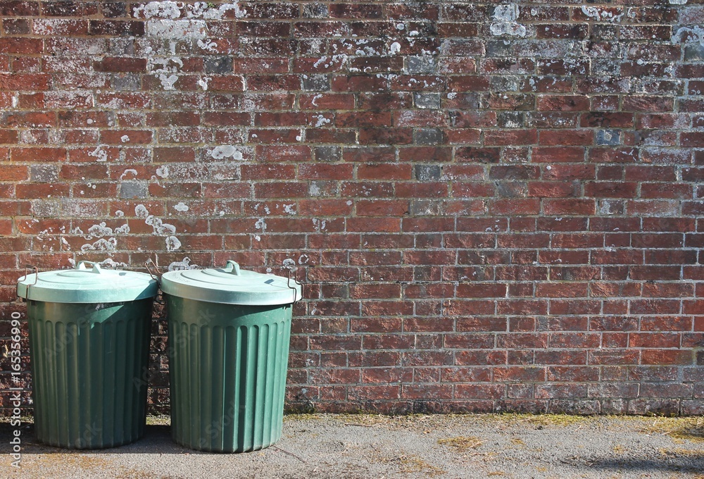 trash can garbage rubbish dustbin outside brick wall background copy ...