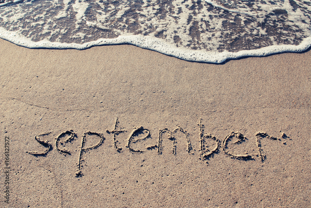 SEPTEMBER on beach sand Stock Photo | Adobe Stock