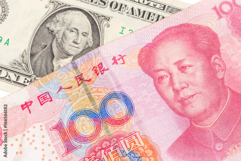 US dollar bill and Chinese yuan banknote on white background, USA and ...