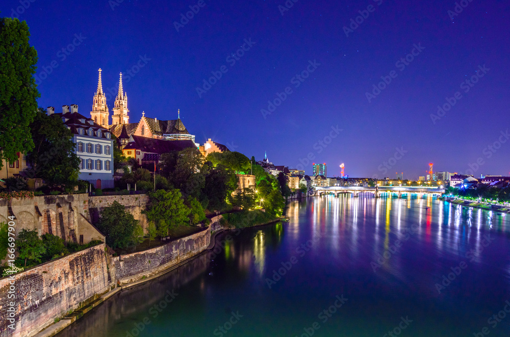 Night view of the Old Town of Basel with red stone Munster cathedral ...