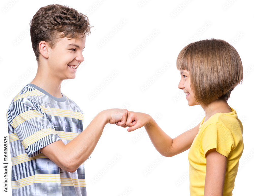 Friendship teen boy and girl are banging their fists. Portrait of happy ...