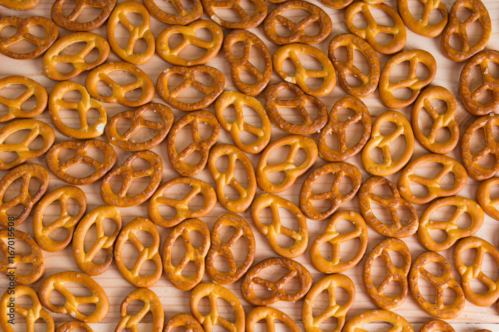 Background texture of salted savory mini pretzels in the traditional ...