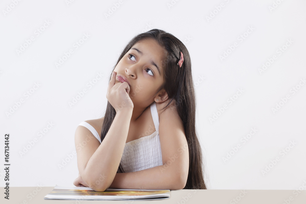 Little girl thinking Stock Photo | Adobe Stock