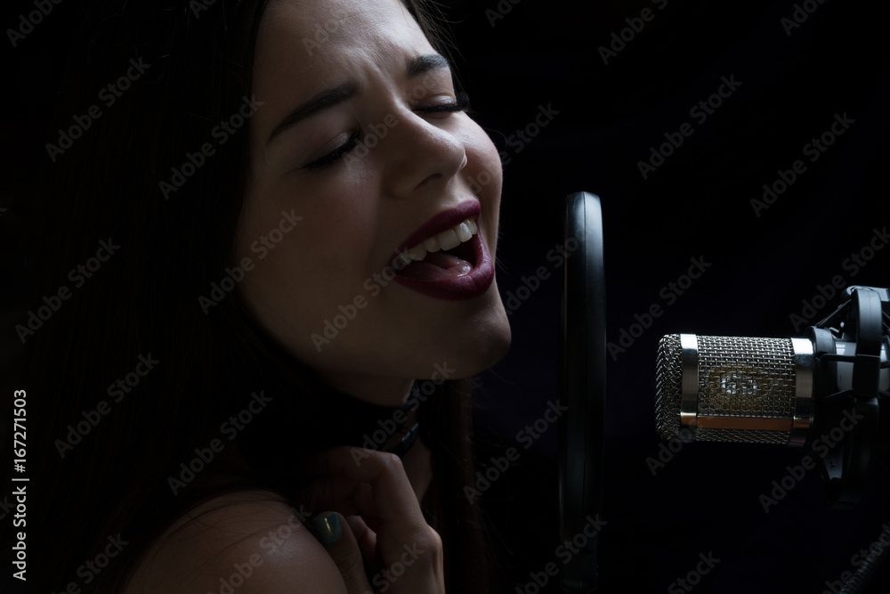 Beautiful girl singing In Recording Studio with microphone Stock Photo ...