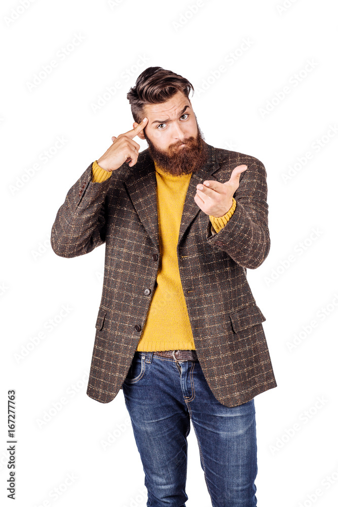 man gesturing with his finger against temple asking are you crazy ...