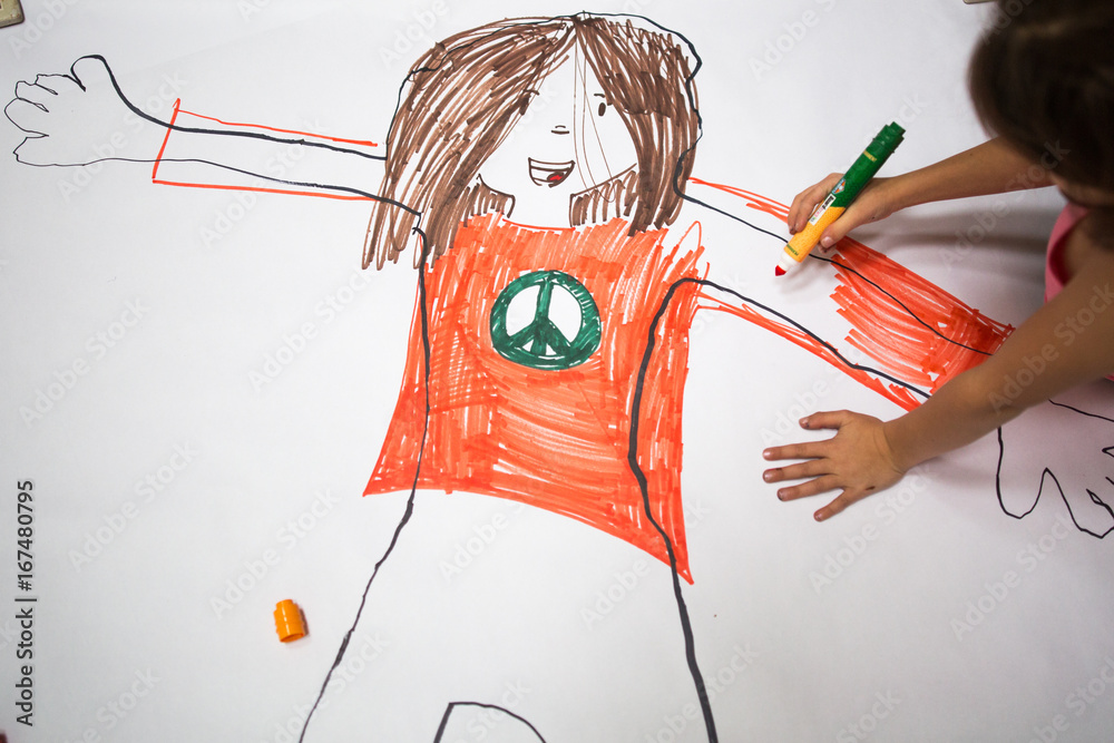 Girl sitting colouring in body trace outline Stock Photo | Adobe Stock