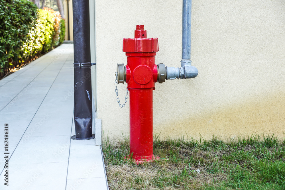 Old red fire hydrant in the street. Fire hidrant for emergency fire ...