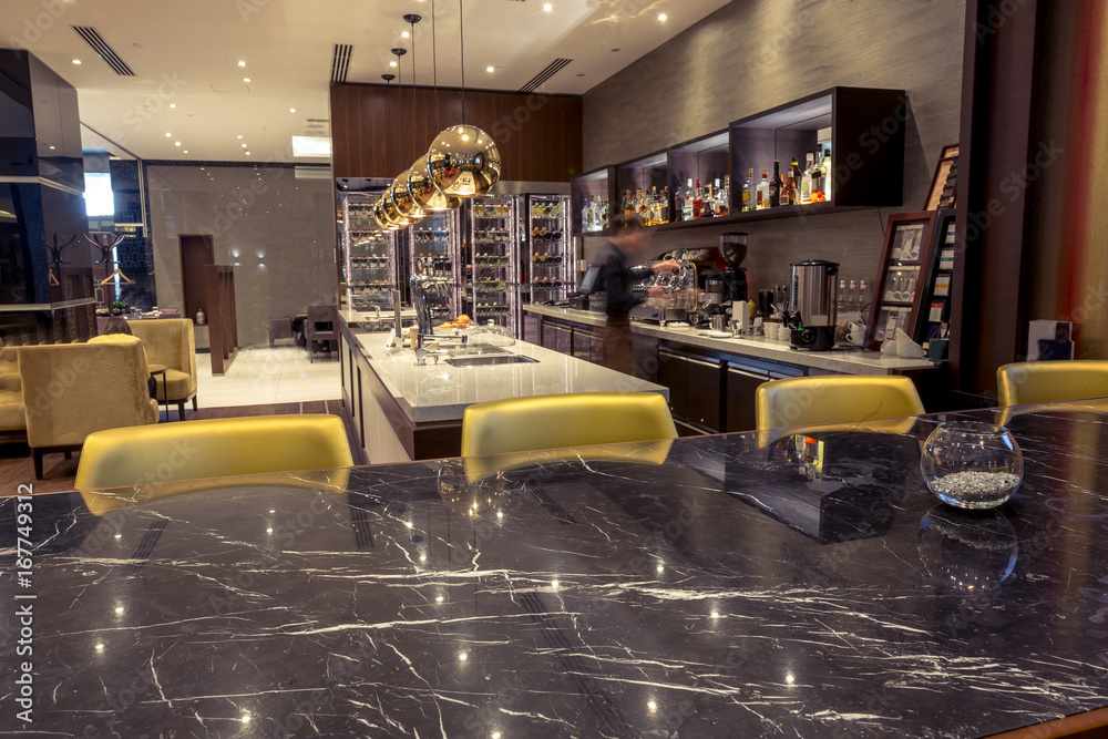 Restaurant kitchen interior: bar counter made of natural stone, fences ...