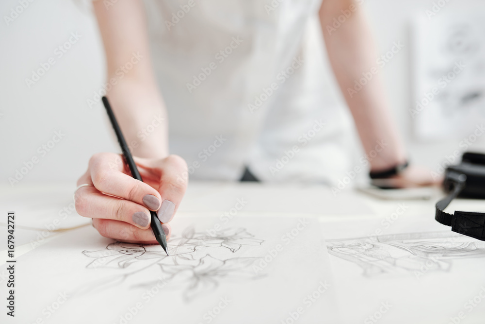 Female illustrator drawing sketches Stock Photo | Adobe Stock