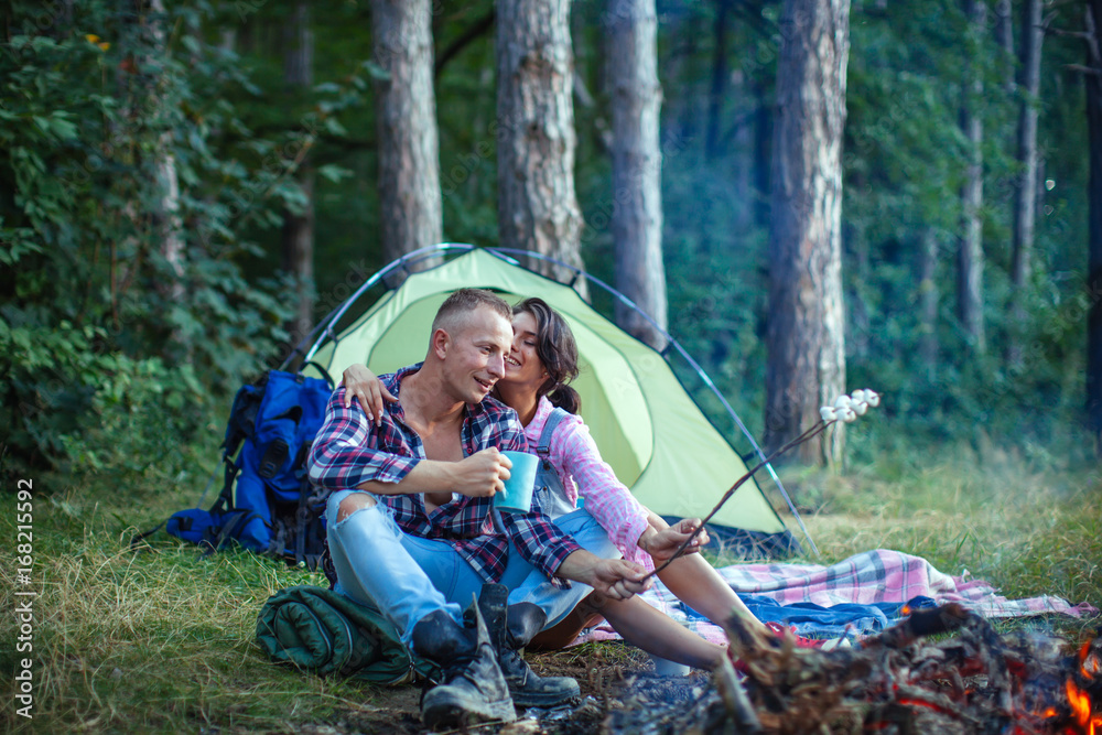 Camping couple. Passionate couple kissing, boy and girl. Having sex ...