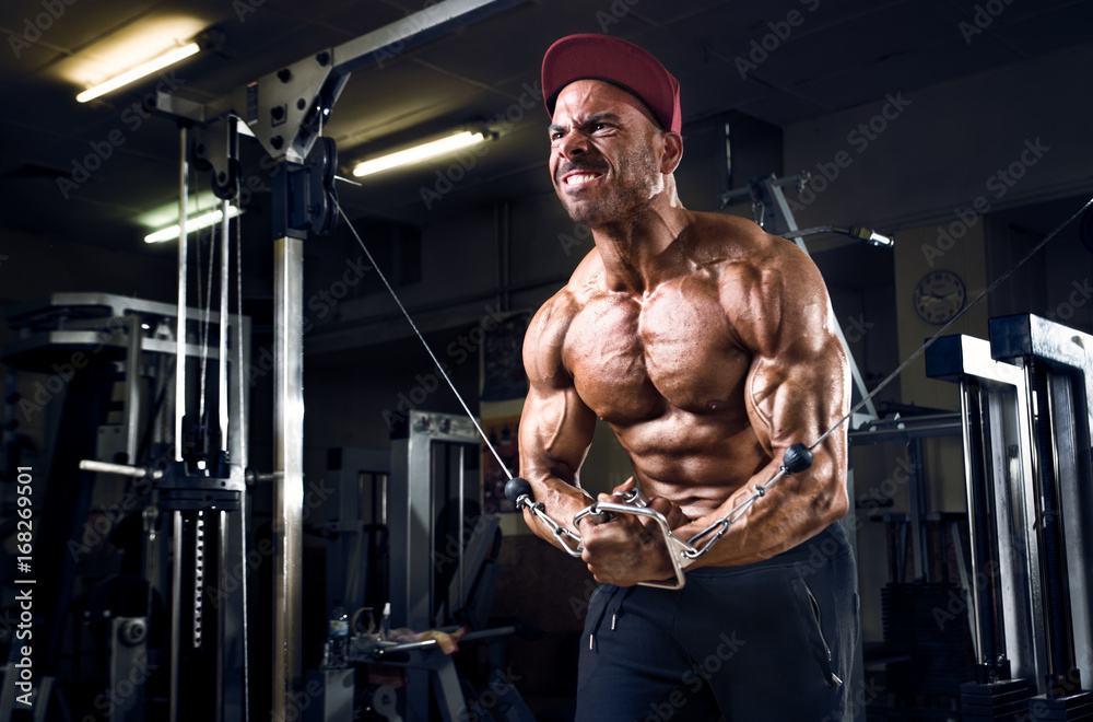 Bodybuilder hard workout for chest muscles Stock Adobe Stock