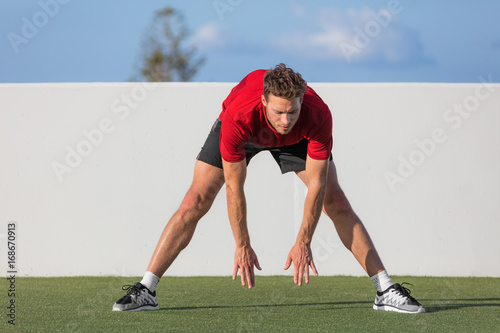 Stretch fitness man toe touch stretching exercise. Standing forward ...