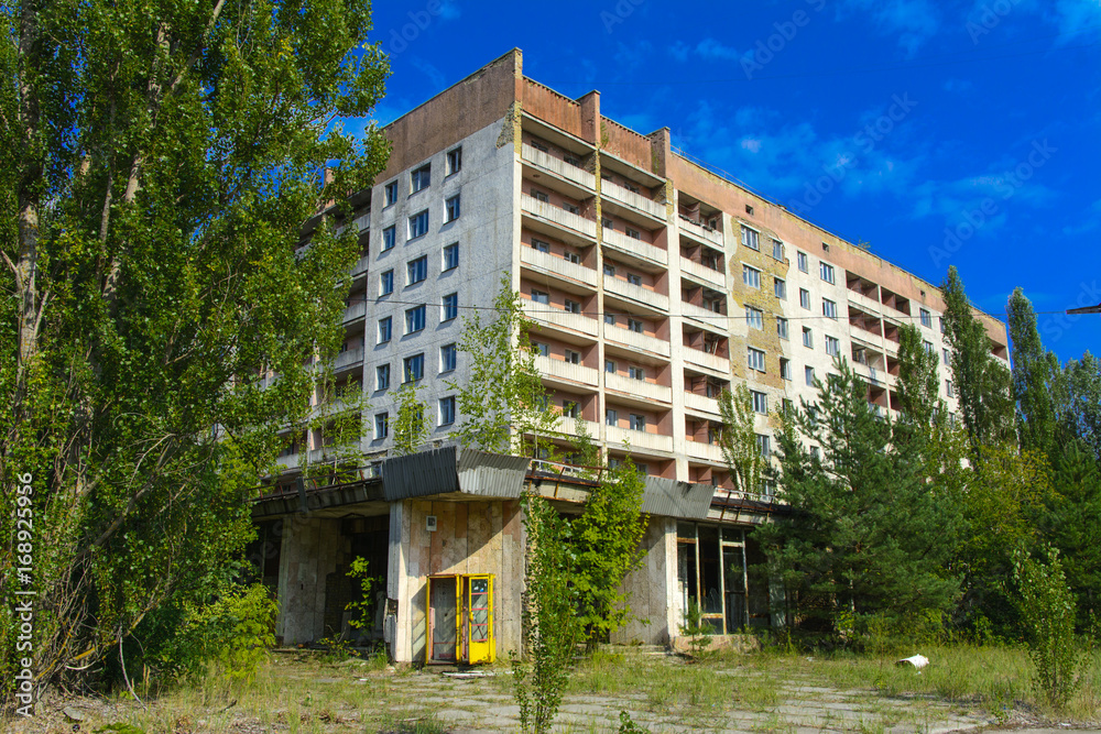 Old abandoned high-rise buildings in a dead radioactive zone. Looting ...