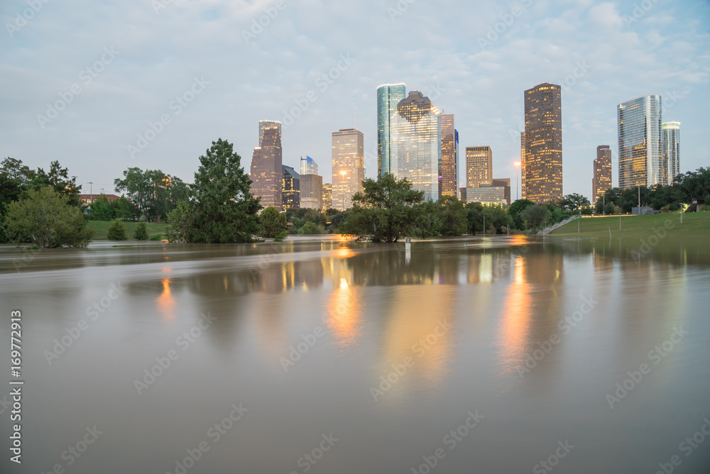 Reflection of Downtown Houston skyscrapers on a pond of overflow water ...