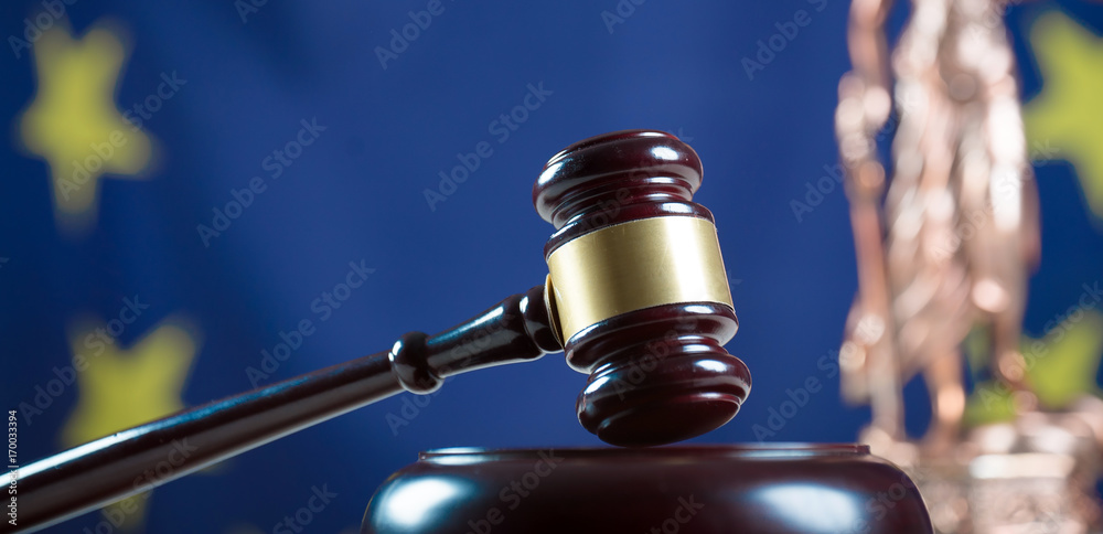 Law and Justice symbols. EU flag background. Stock Photo | Adobe Stock